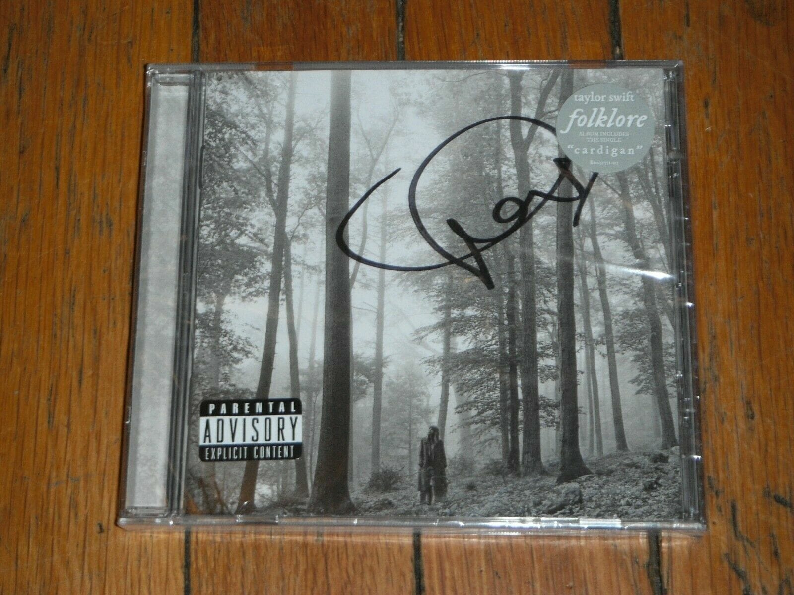 TAYLOR SWIFT SIGNED FOLKLORE CD COVER CARDIGAN | Autographia