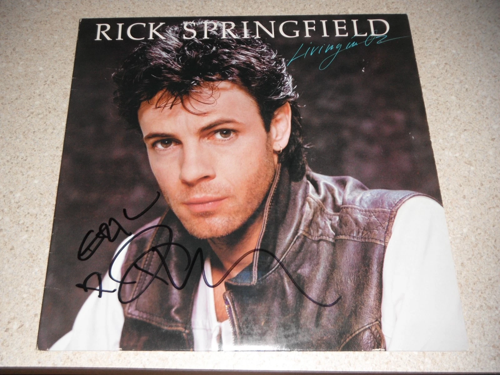 RICK SPRINGFIELD SIGNED LIVING IN OZ VINYL ALBUM | Autographia