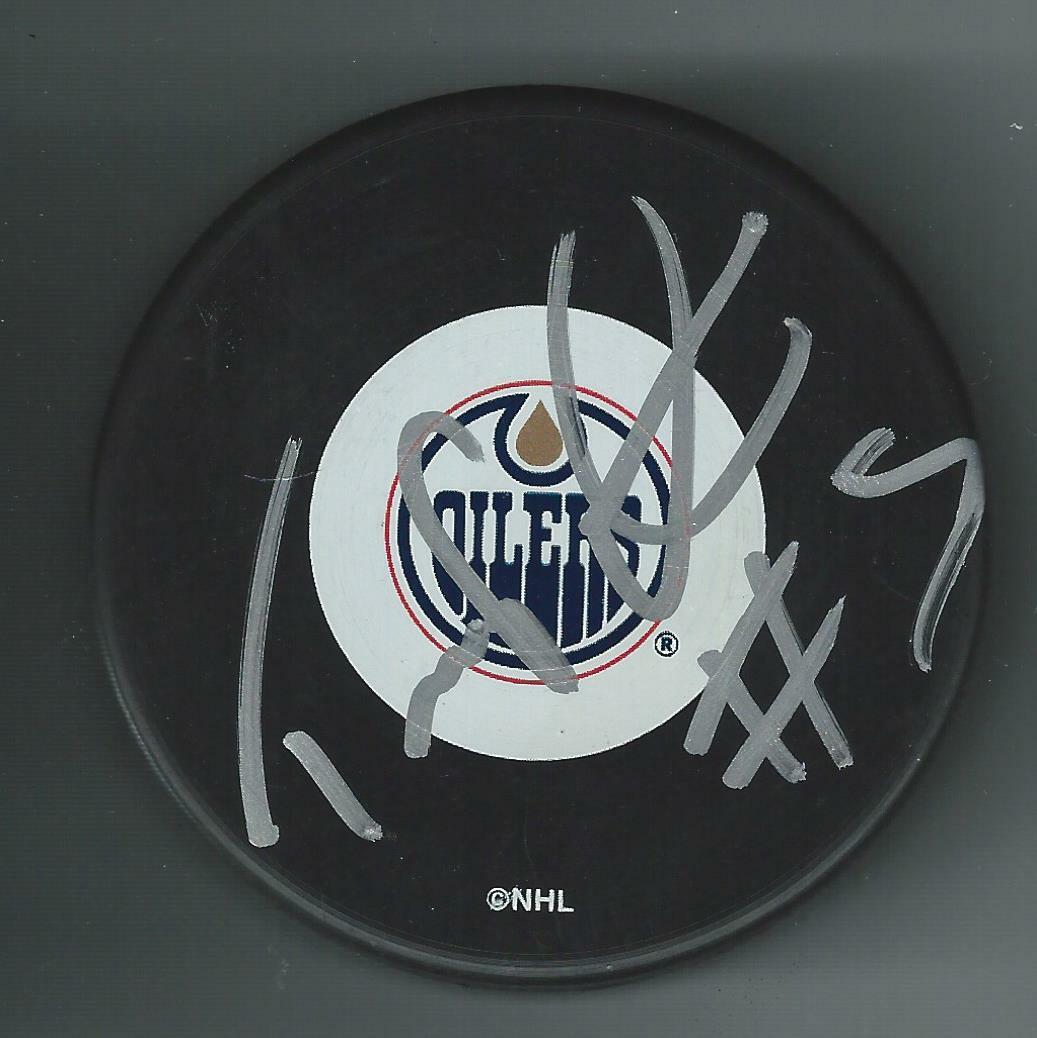 Tom Poti Signed Edmonton Oilers Puck | Autographia